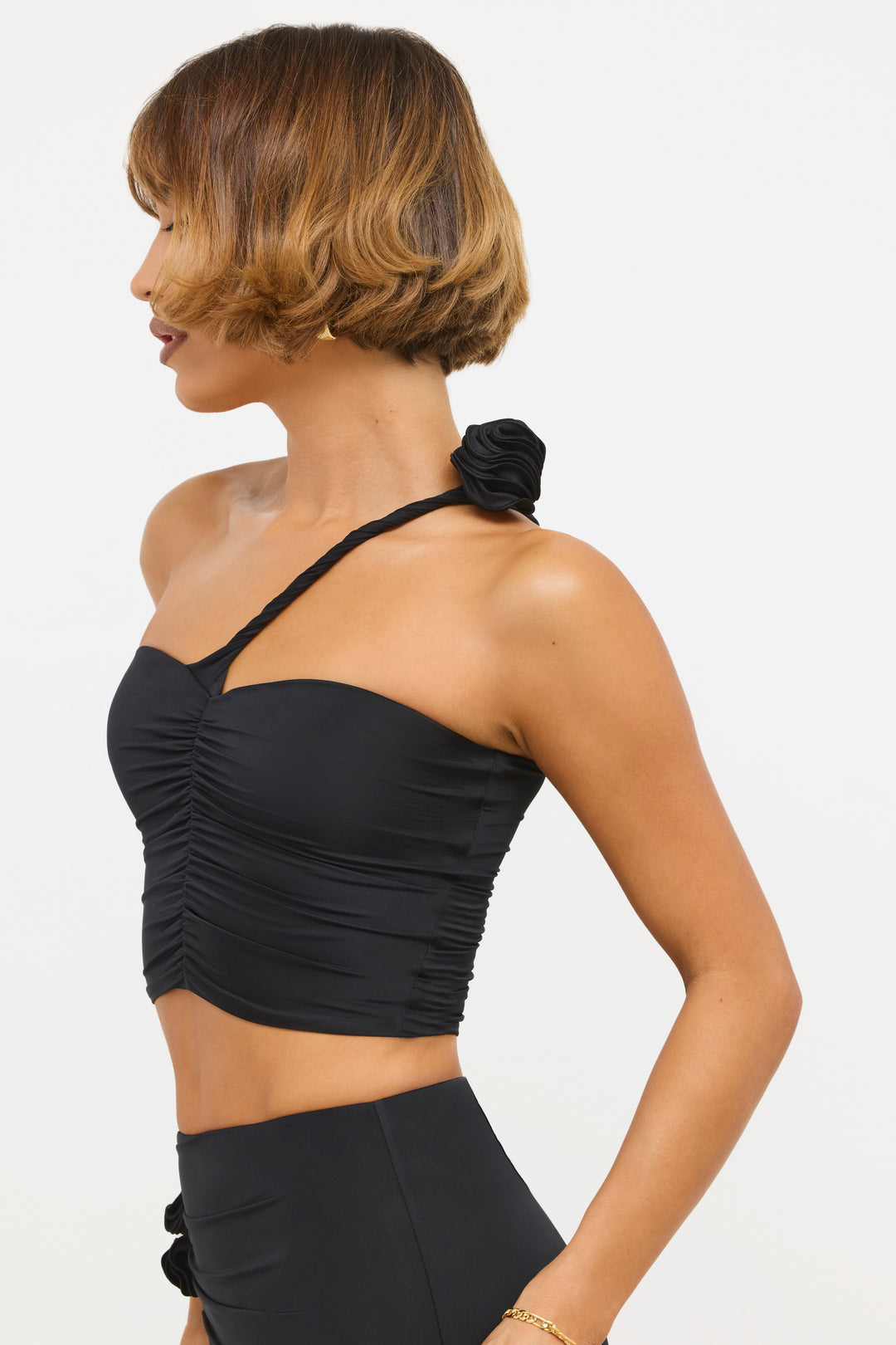 Tesia Slinky Jersey Rose Detail Asymmetric Ruched Top in Black | Oh Polly