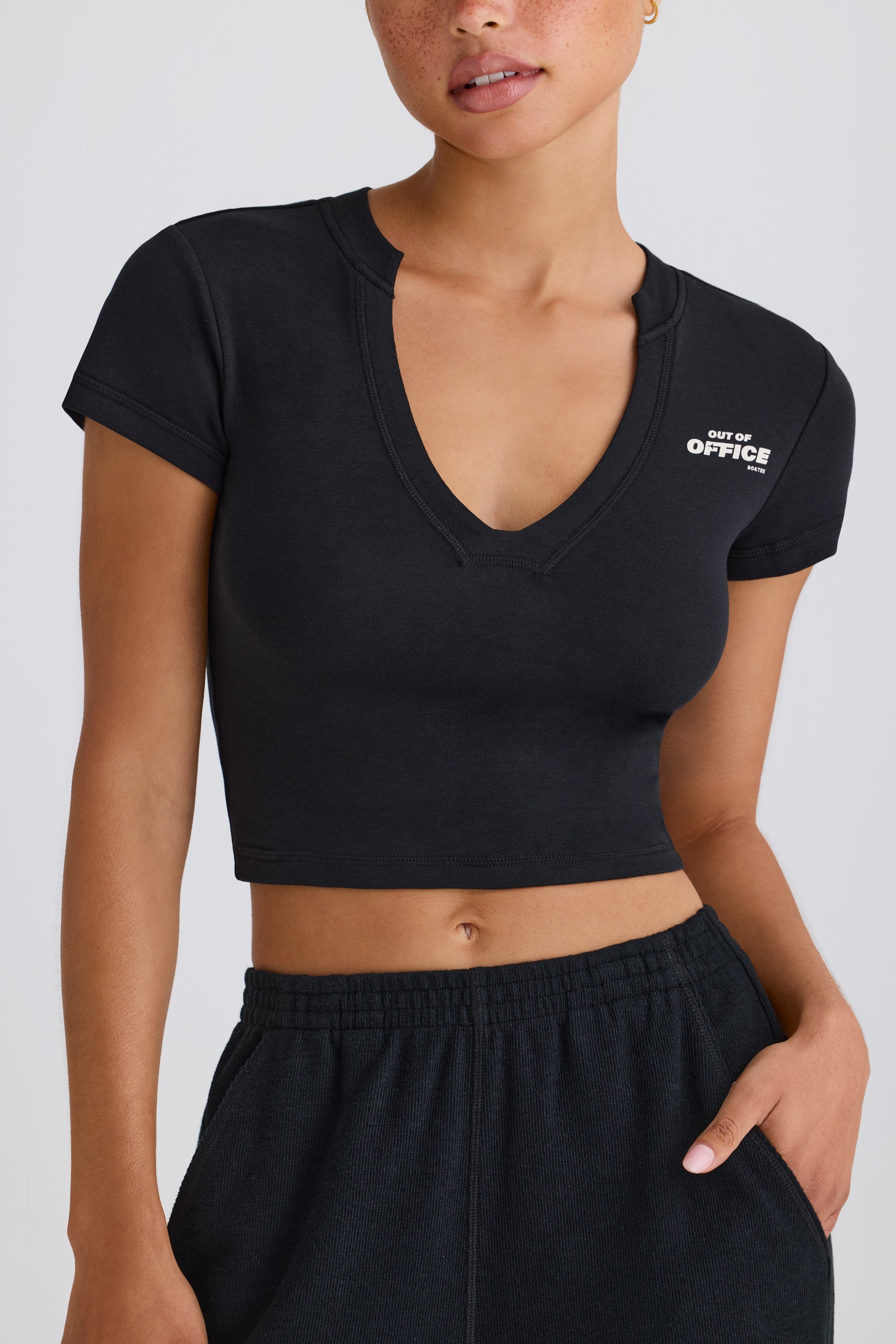 Jet Set Graphic-Print Cropped T-Shirt in Black | Oh Polly